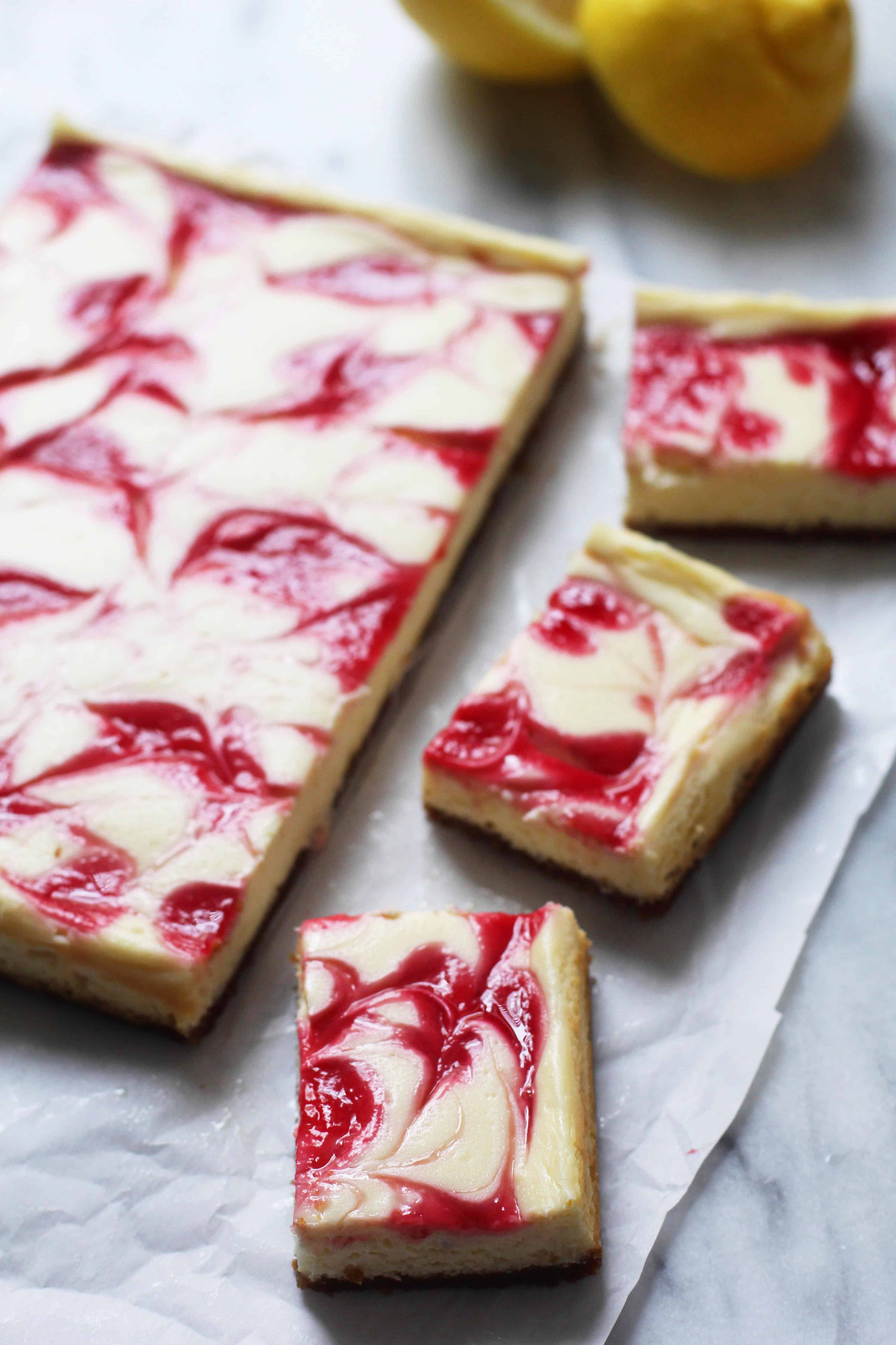 Raspberry Swirled Lemon Cheesecake Bars - The Baker Chick